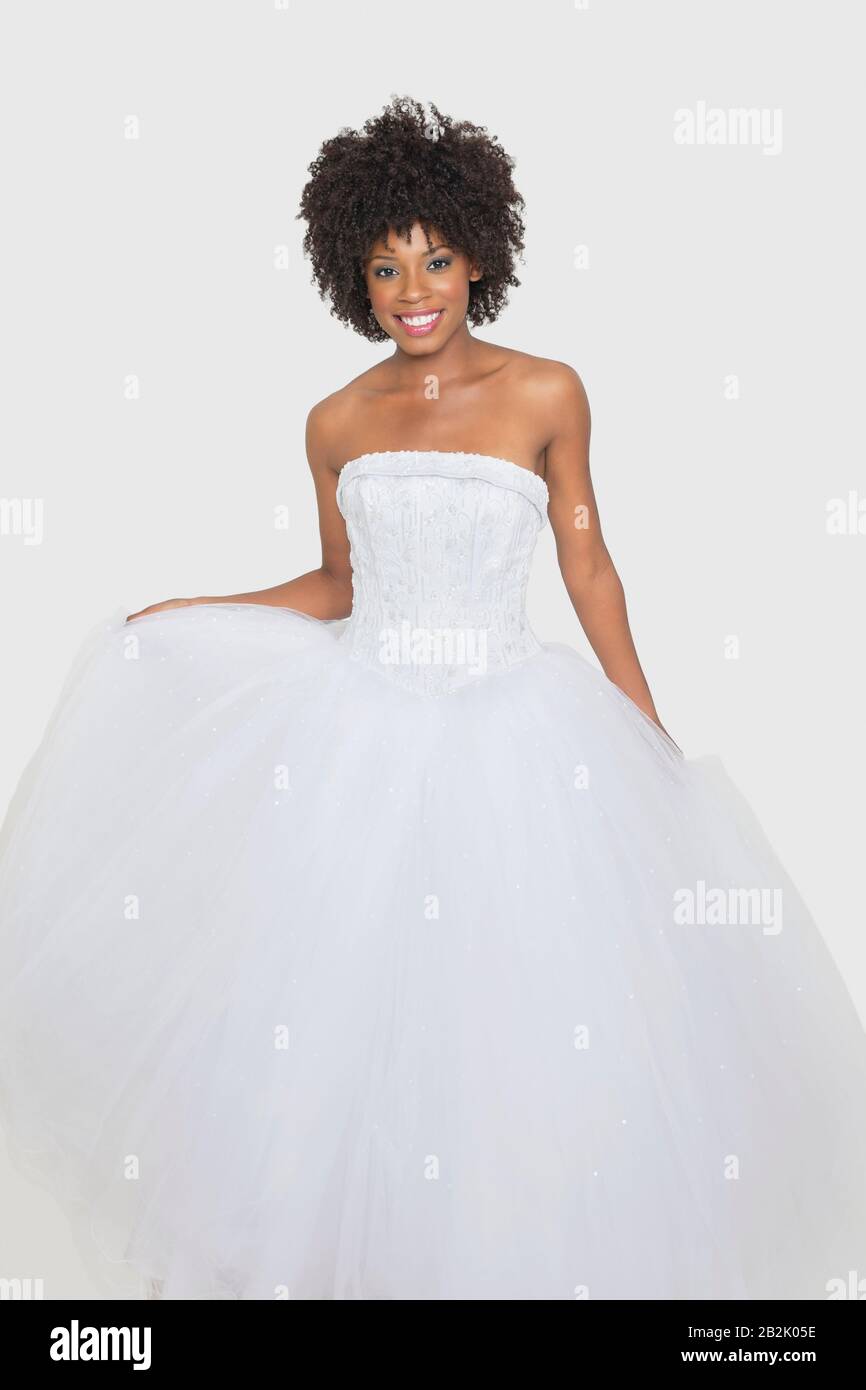 Portrait of beautiful African American bride in white wedding dress ...