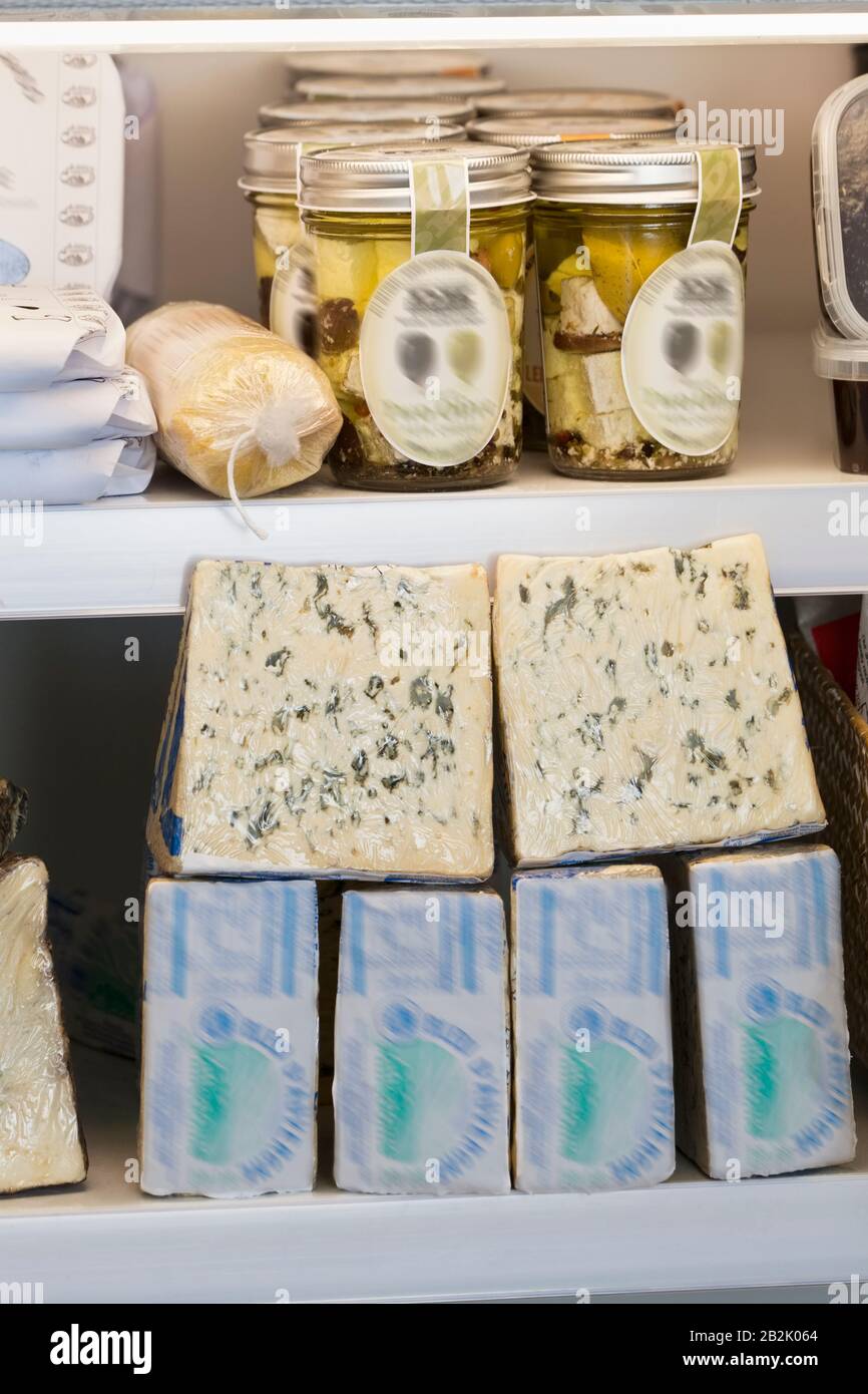 Variety of cheese blocks and jars on shelf Stock Photo - Alamy