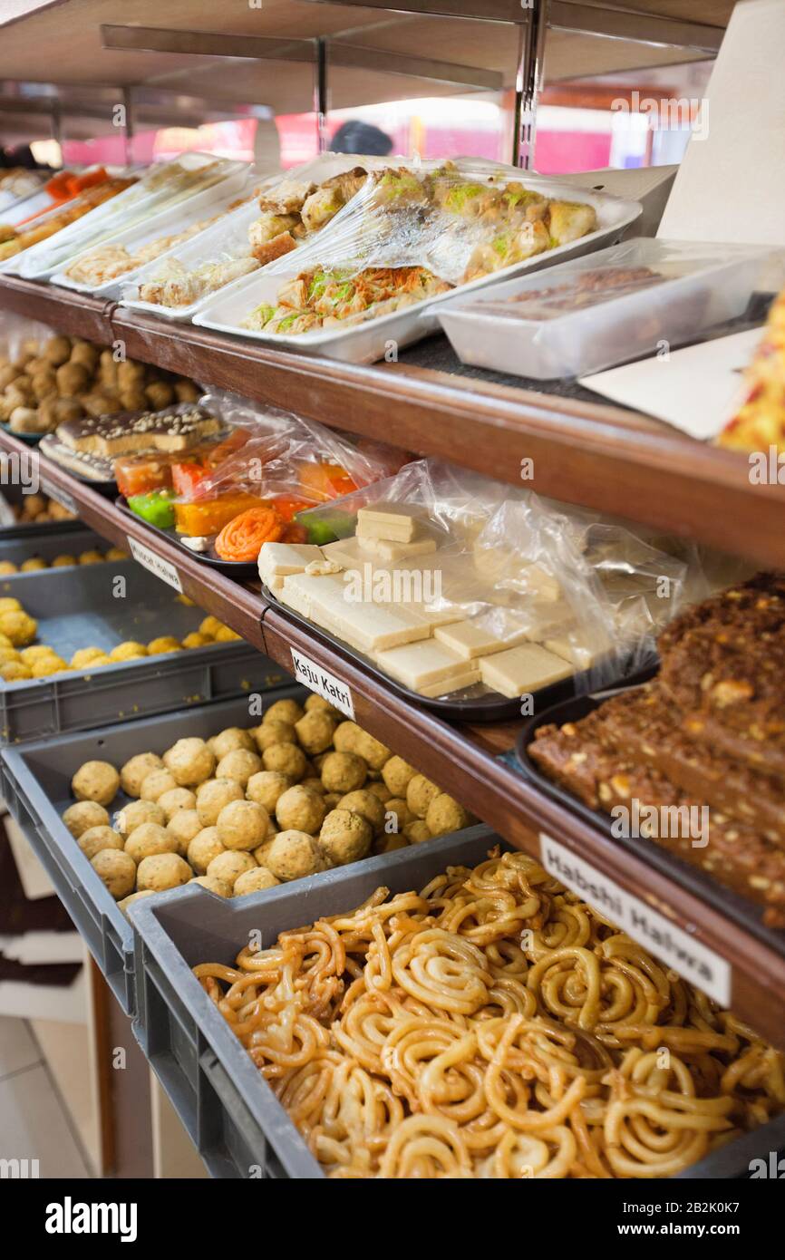 Variety of Indian sweet food displayed at store Stock Photo - Alamy