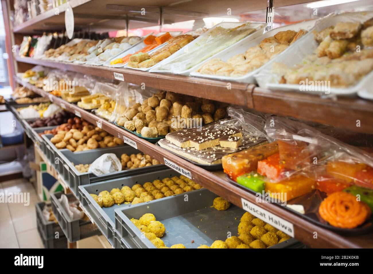 Variety of Indian sweets displayed at store Stock Photo - Alamy
