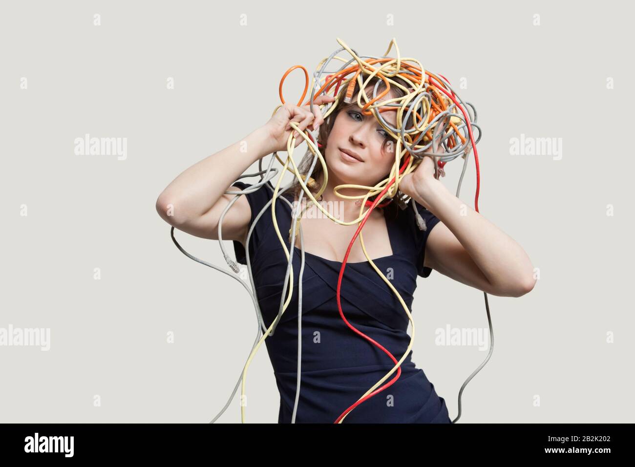 Woman with tangled cables hi-res stock photography and images - Alamy