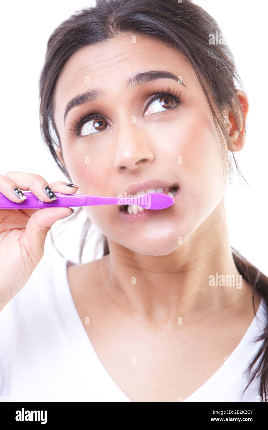 Ethnic girl brushing teeth hi-res stock photography and images - Alamy