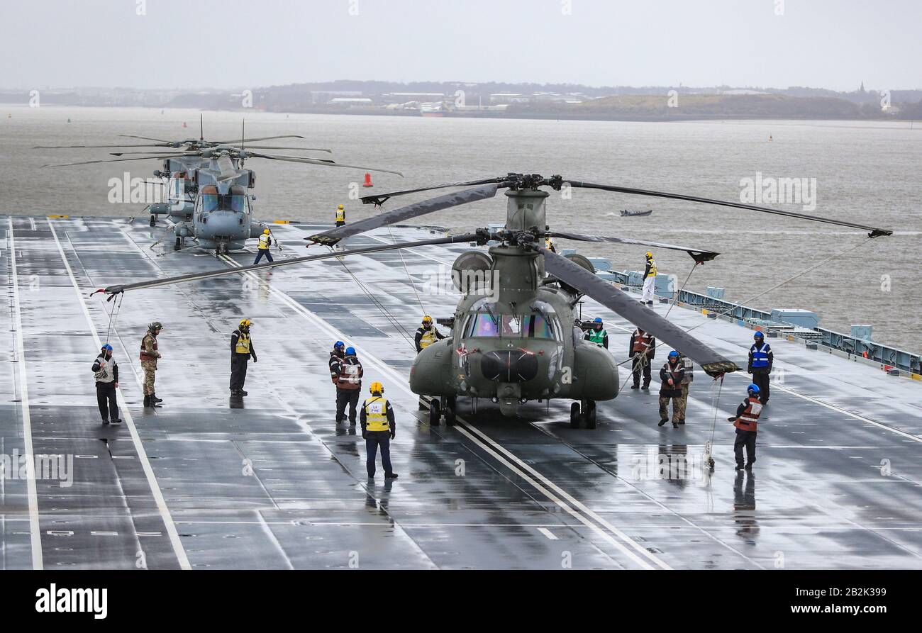 A Chinook,and two Merlin helicopters on the deck of the Royal Navy ...