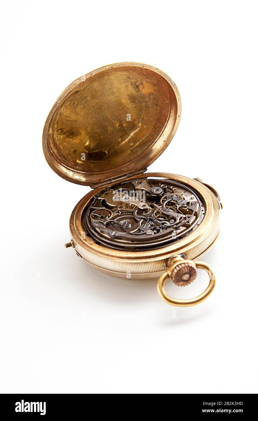 Clockwork inside pocket stopwatch over white background Stock Photo - Alamy
