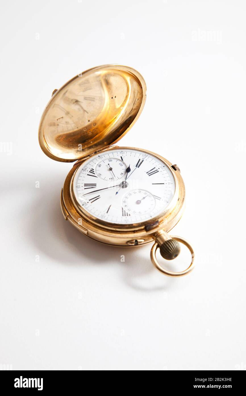 Golden pocket stopwatch over white background Stock Photo - Alamy