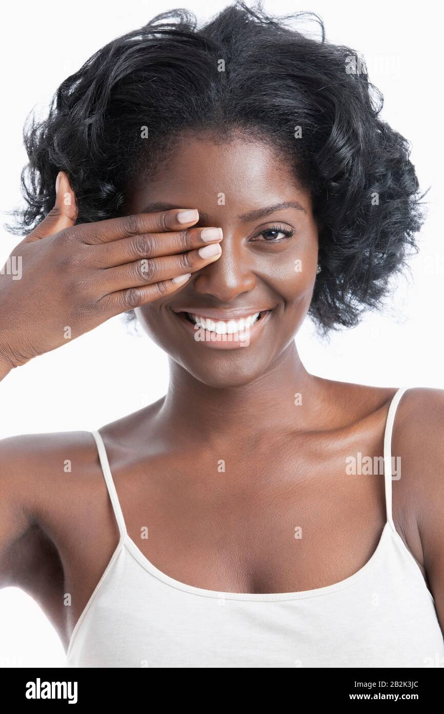 Hand over eyes peeking woman hi-res stock photography and images - Alamy