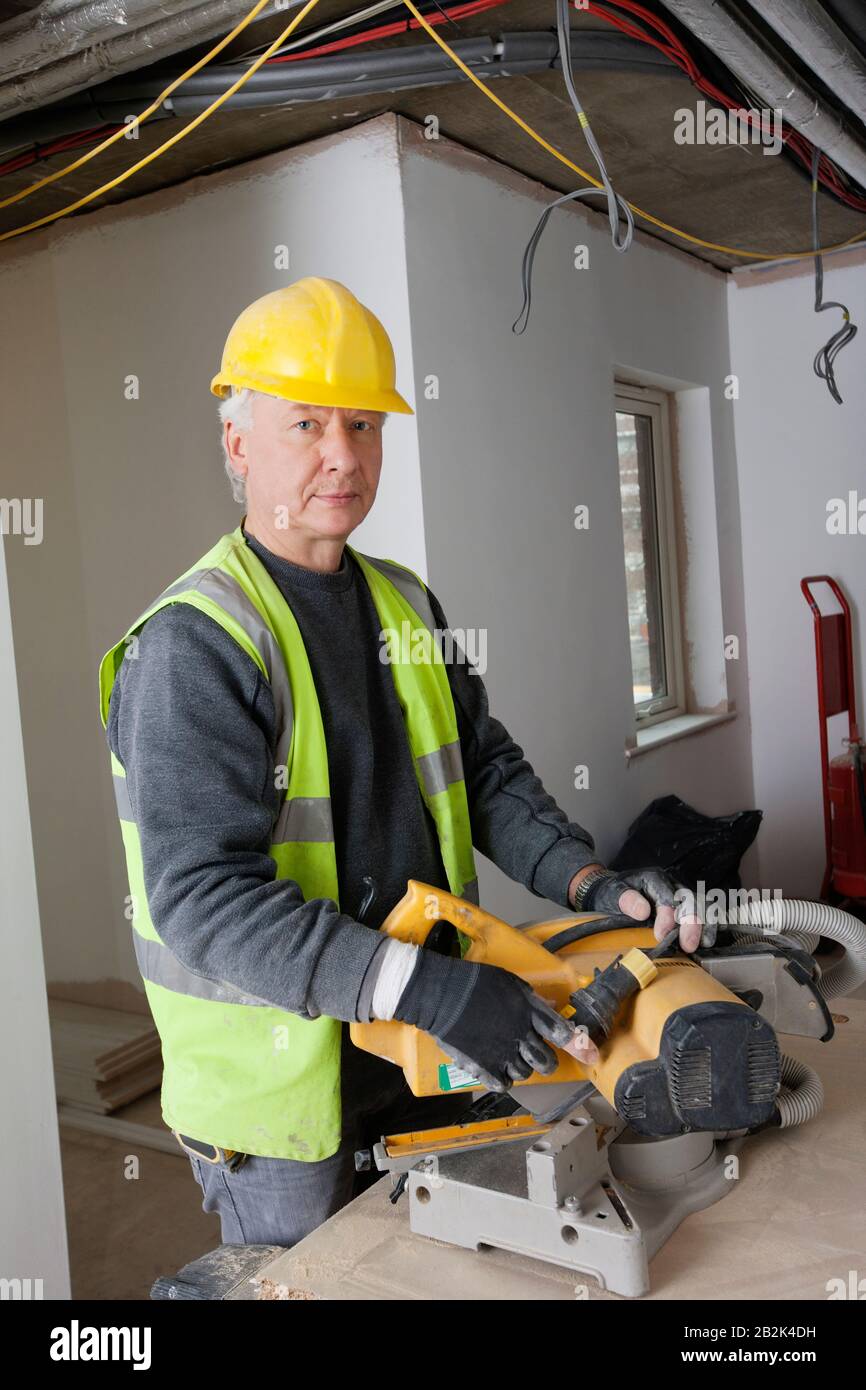 Portrait of middle-aged worker at construction site Stock Photo - Alamy