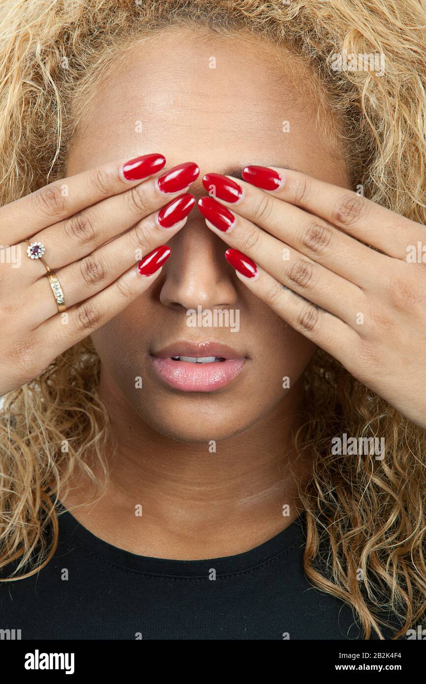 Mixed race young woman covering eyes Stock Photo - Alamy Mixed race young woman covering eyes Stock Photo - Alamy