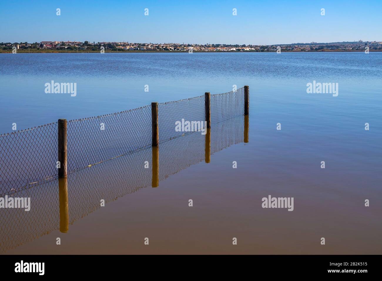 Fence disappearing into water and distant horizon at Torrevieja and La ...