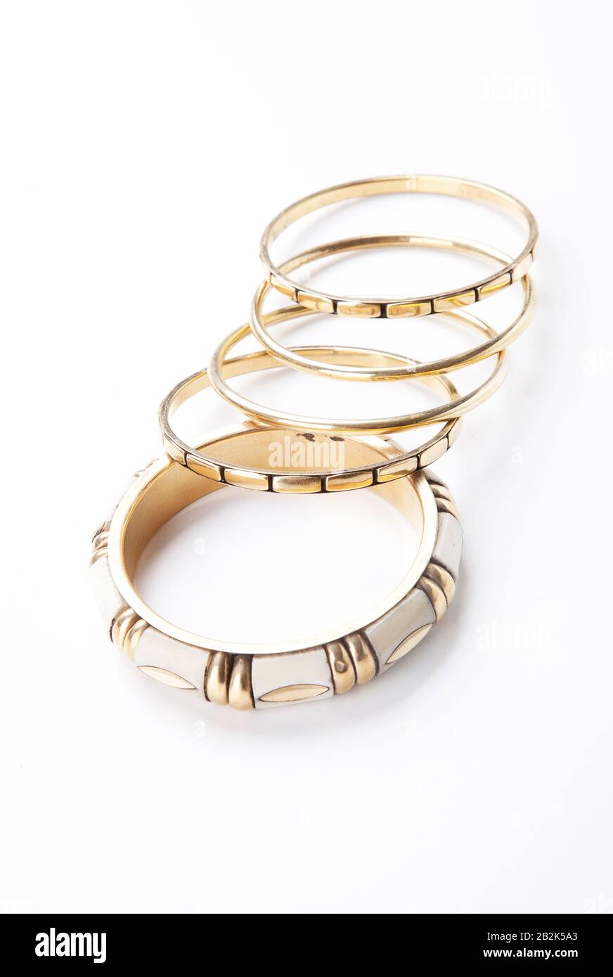 Trendy bangles over white background Stock Photo - Alamy