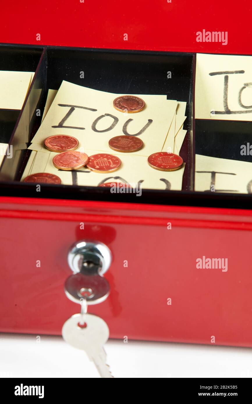 Open box with IOU notes and coins Stock Photo - Alamy