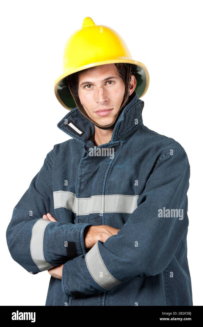 Fireman wearing uniform and hat in studio Stock Photo - Alamy