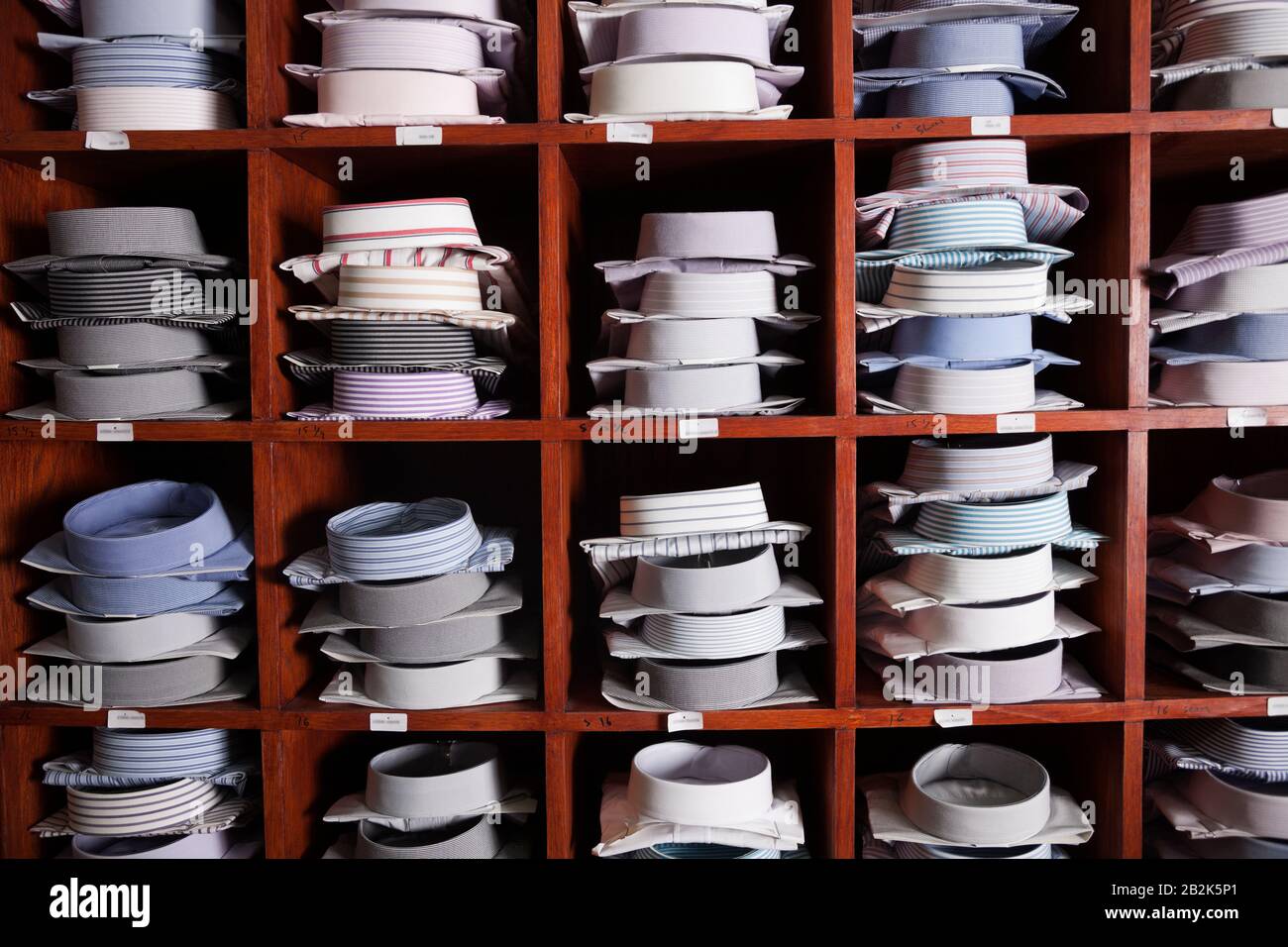 Shelf with folded shirts hi-res stock photography and images - Alamy
