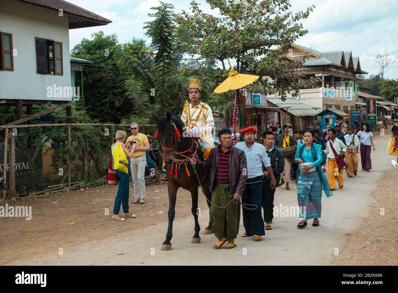 Traditional parade for Burmese child becoming a novice monk in Inthein ...