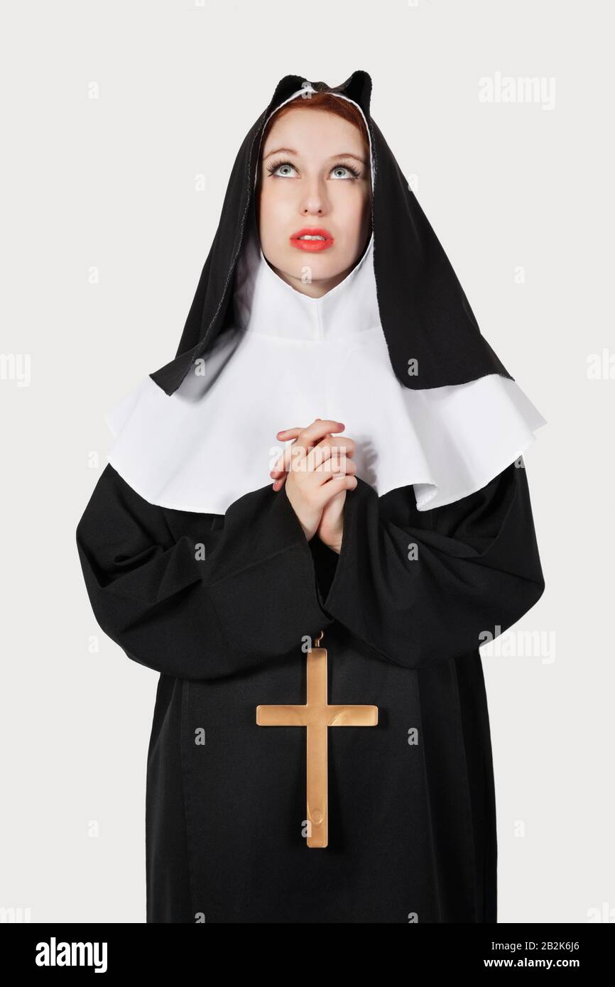 Nun praying hi-res stock photography and images - Alamy