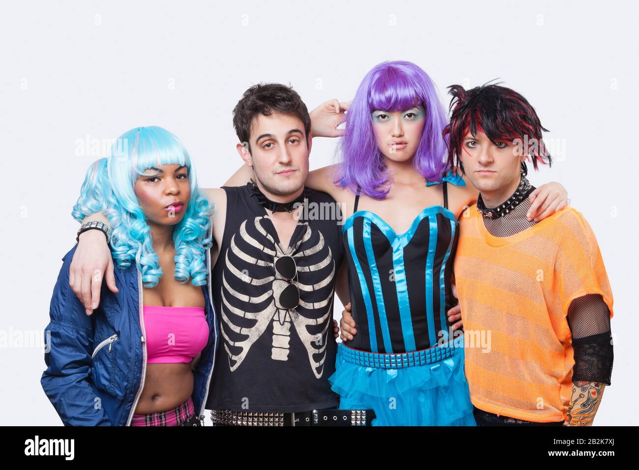 Portrait of four young punk group over white background Stock Photo - Alamy