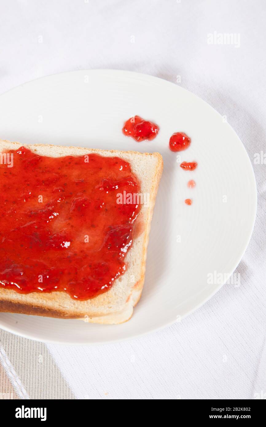 Close-up of jam spread on slice of bread Stock Photo - Alamy