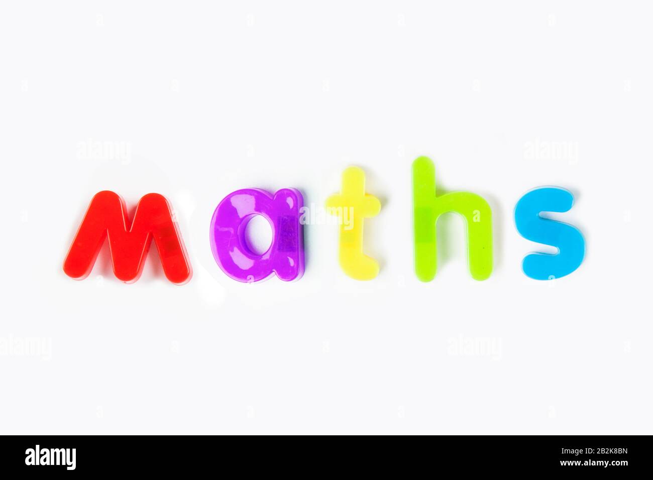 Colorful alphabet magnets spelling 'maths' over white background Stock ...