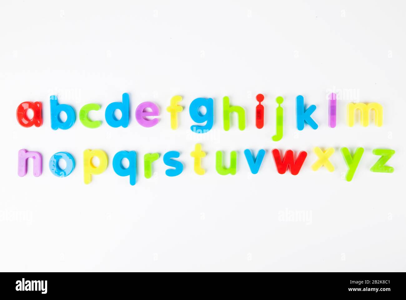 Alphabet magnets arranged in order over white background Stock Photo ...