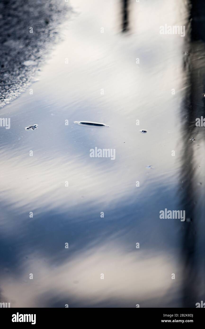 Cloud reflecting in puddle hi-res stock photography and images - Alamy