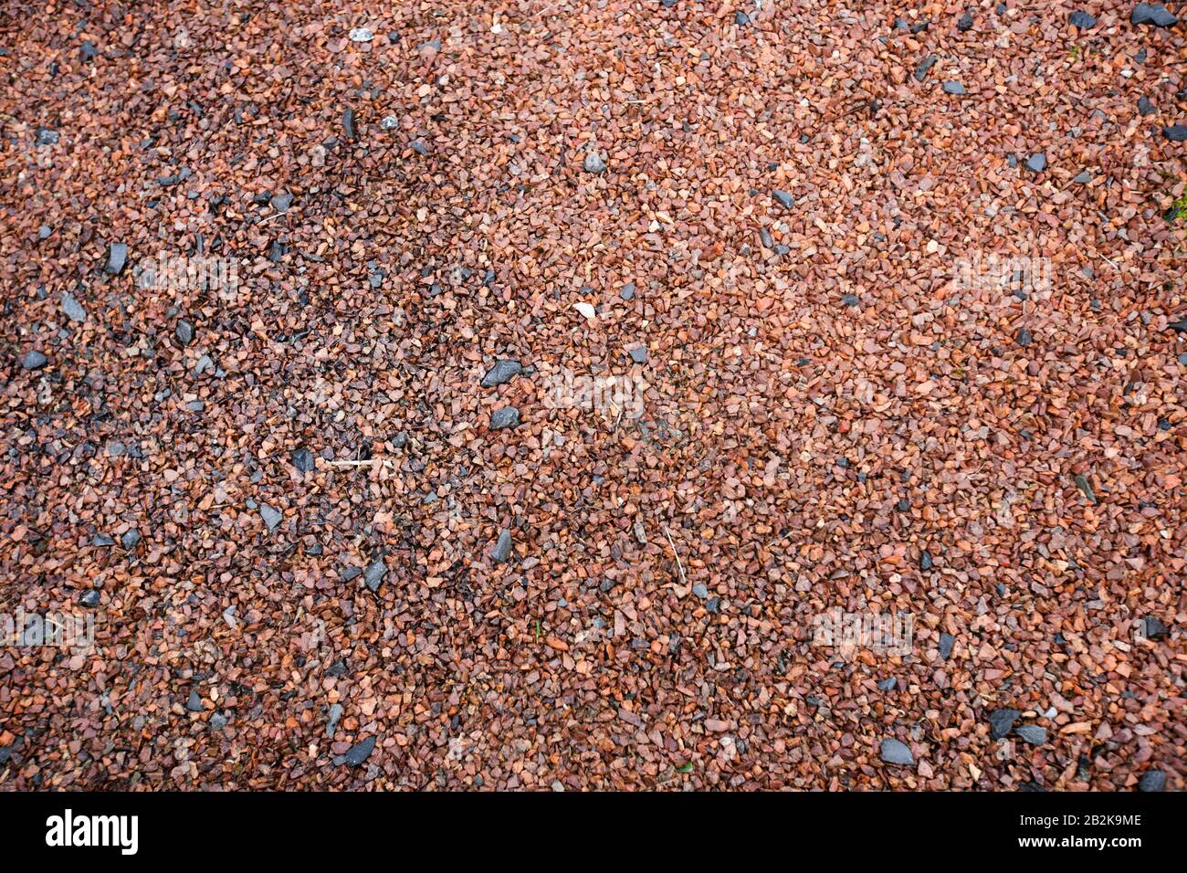 Red gravel with some grey gravel Stock Photo - Alamy