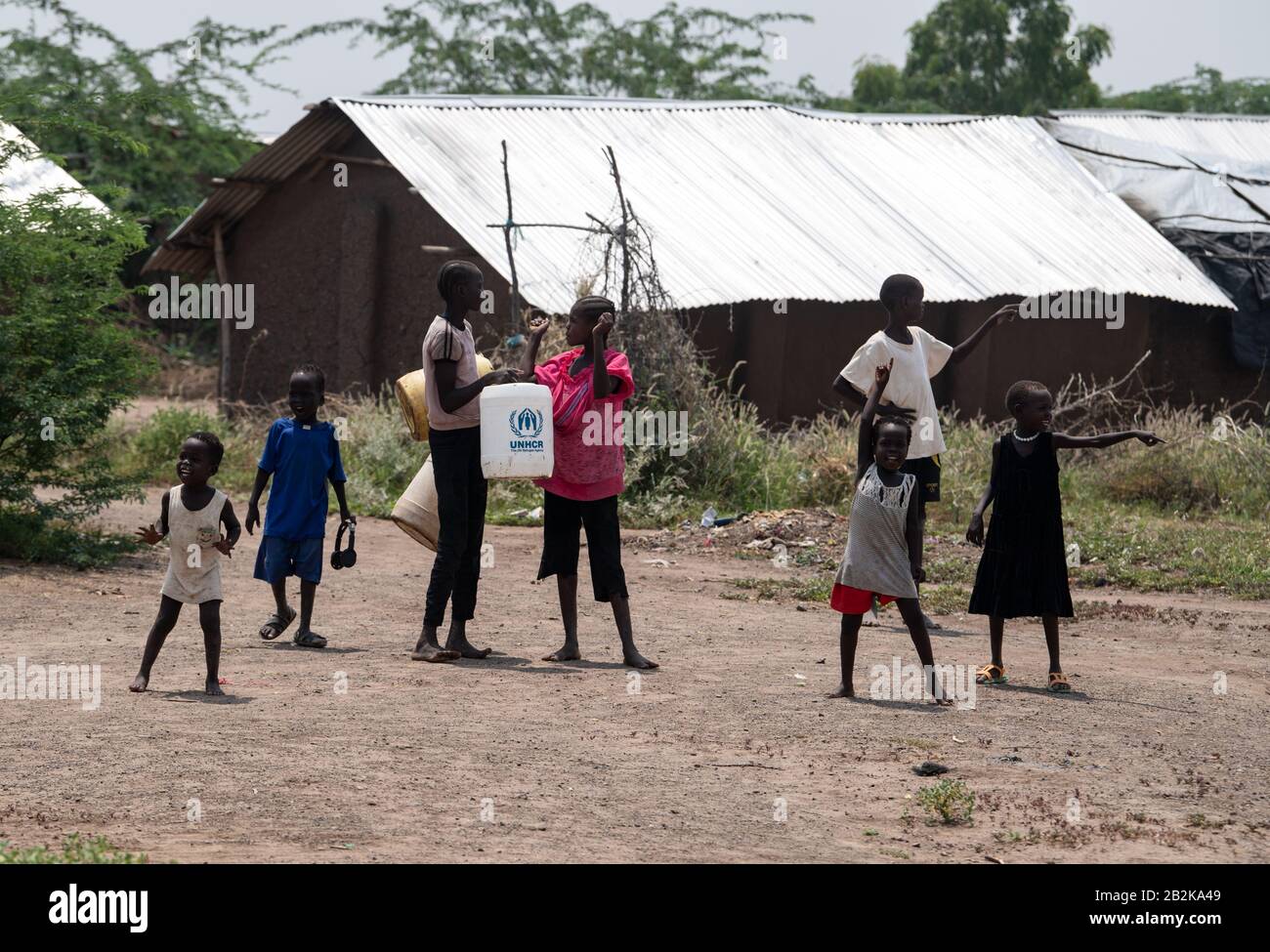 26 February 2020, Kenya, Kakuma: Children stand in front of houses with ...