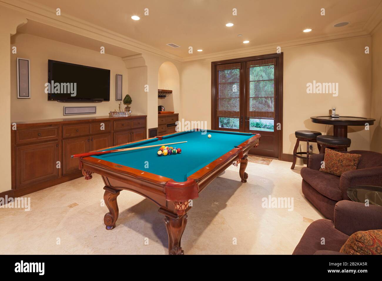 Billiards table in games room Stock Photo - Alamy