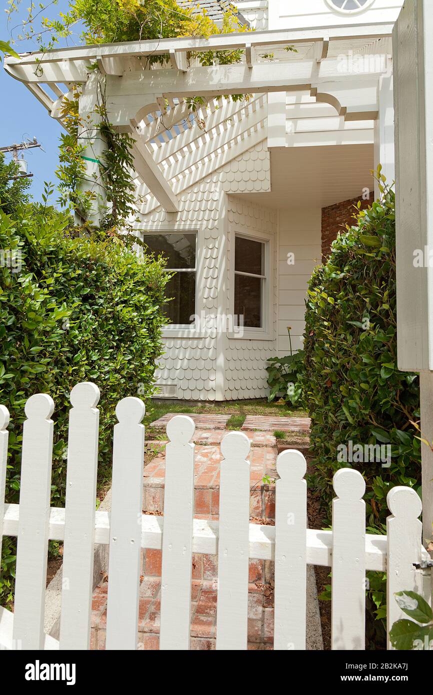 Close gate with path leading to front door Stock Photo - Alamy