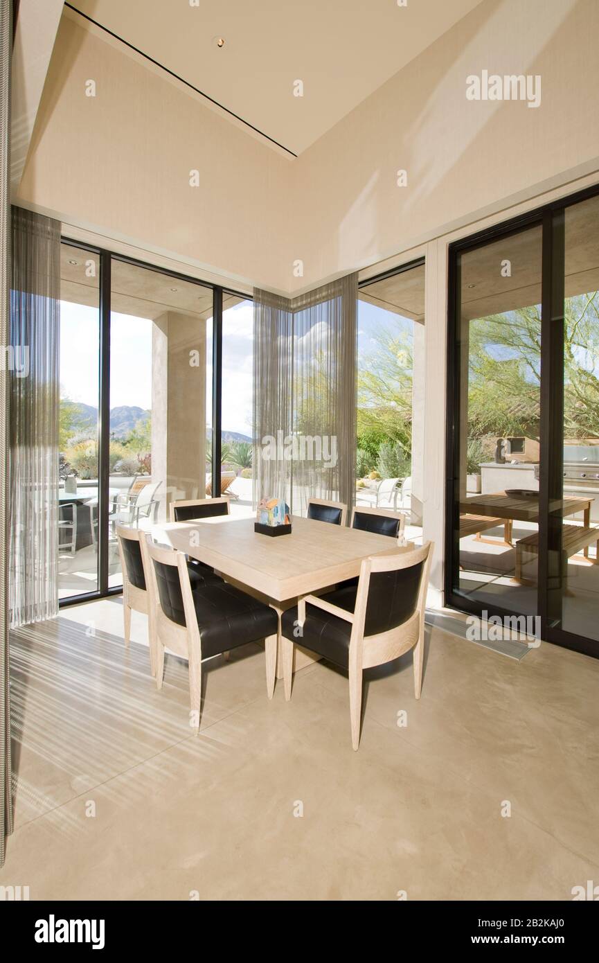 Dining table by window Stock Photo - Alamy