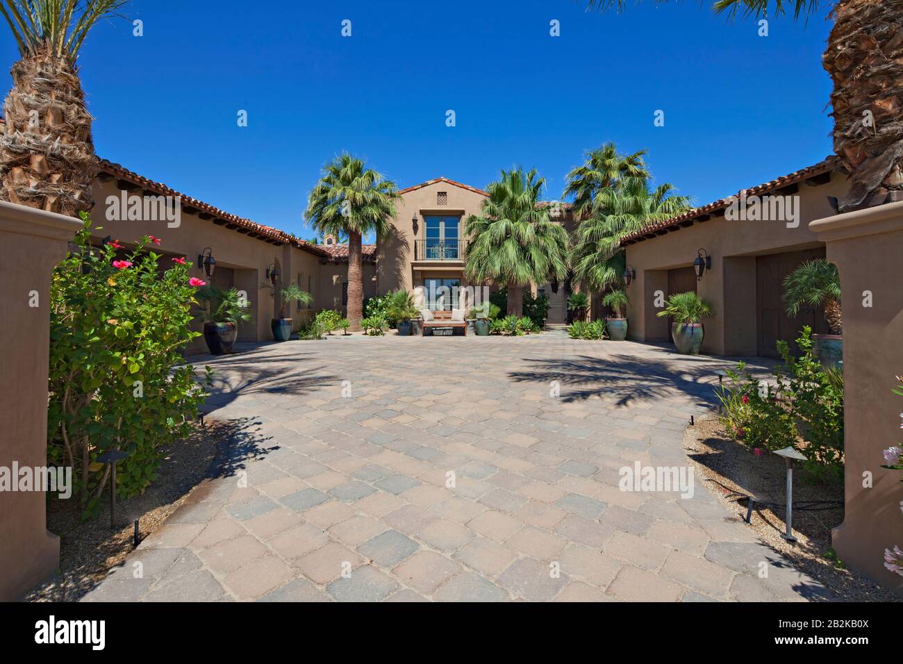 View up the driveway of luxury villa Stock Photo - Alamy