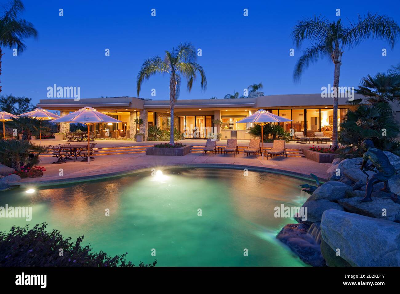 View over a pool with palm trees hi-res stock photography and images ...