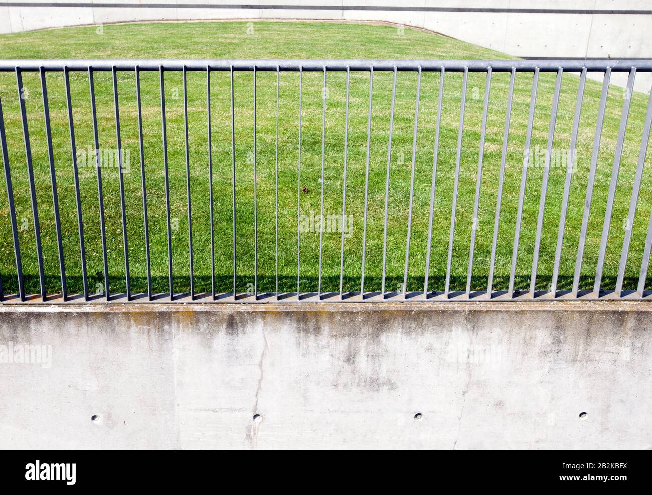Metal railings in front of grass Stock Photo - Alamy