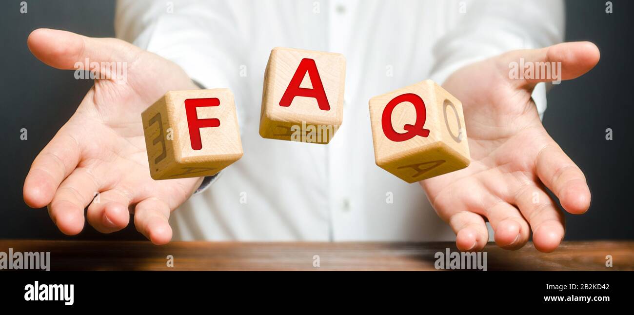 Cubes thrown by a man make word abbreviation acronym FAQ (frequently ...