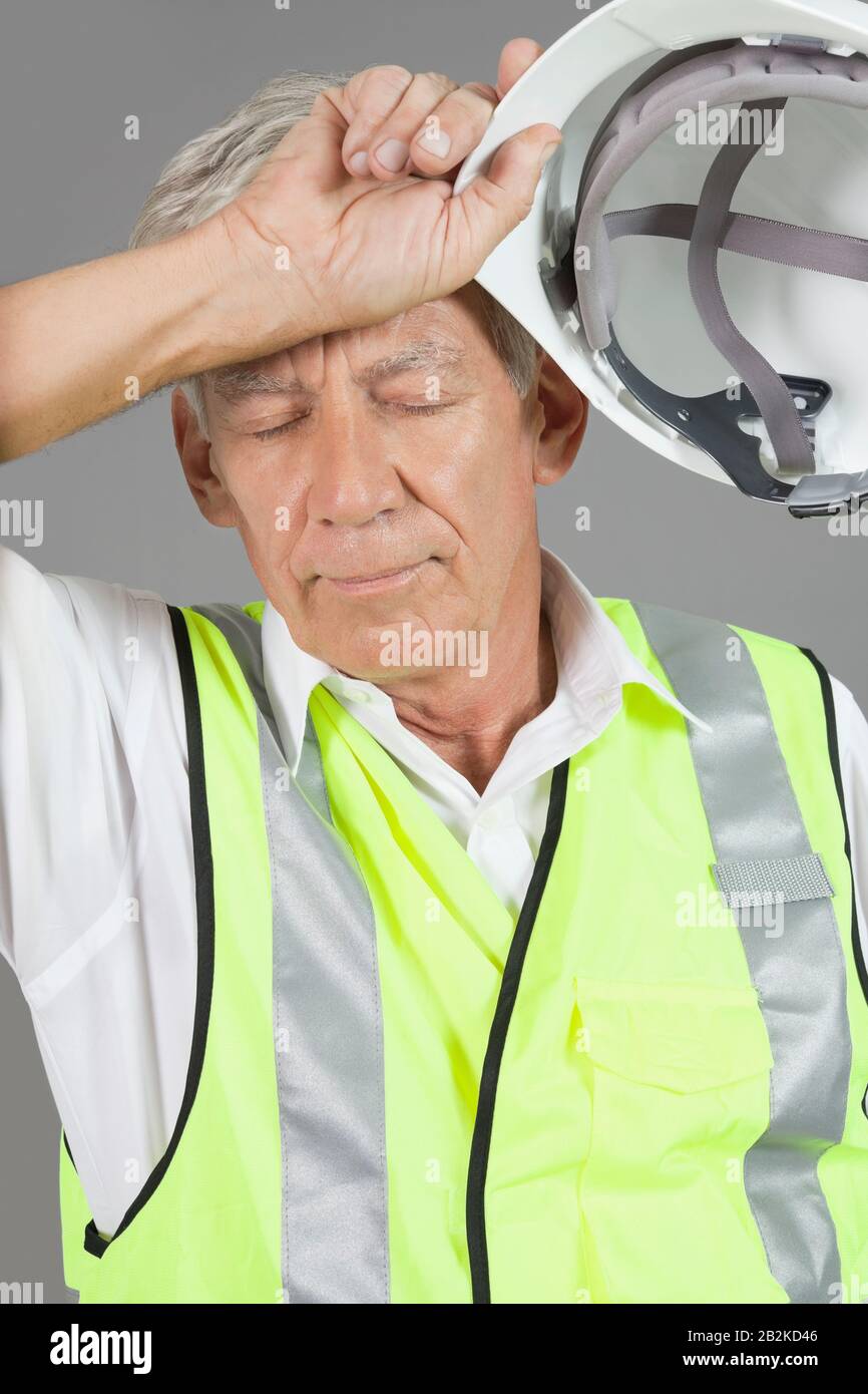 Man wiping his brow hi-res stock photography and images - Alamy