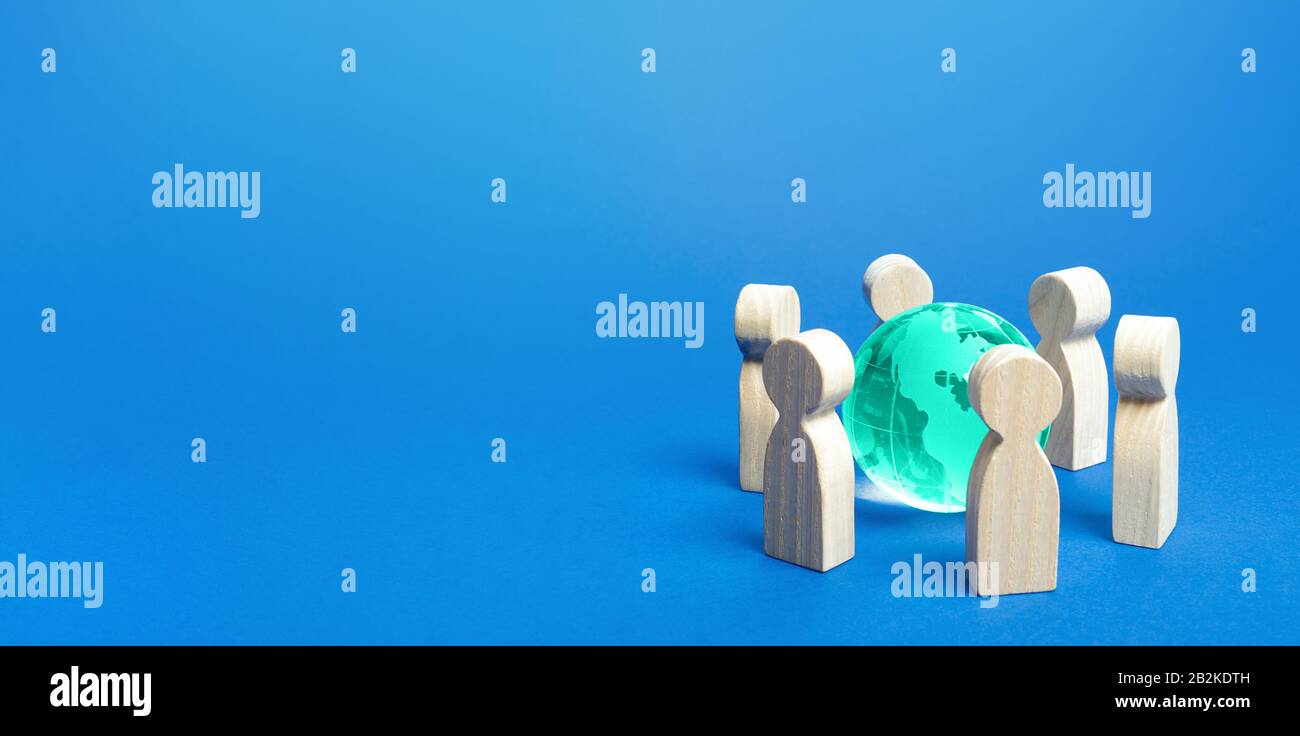 Blue earth globe is surrounded by people. Global communication ...