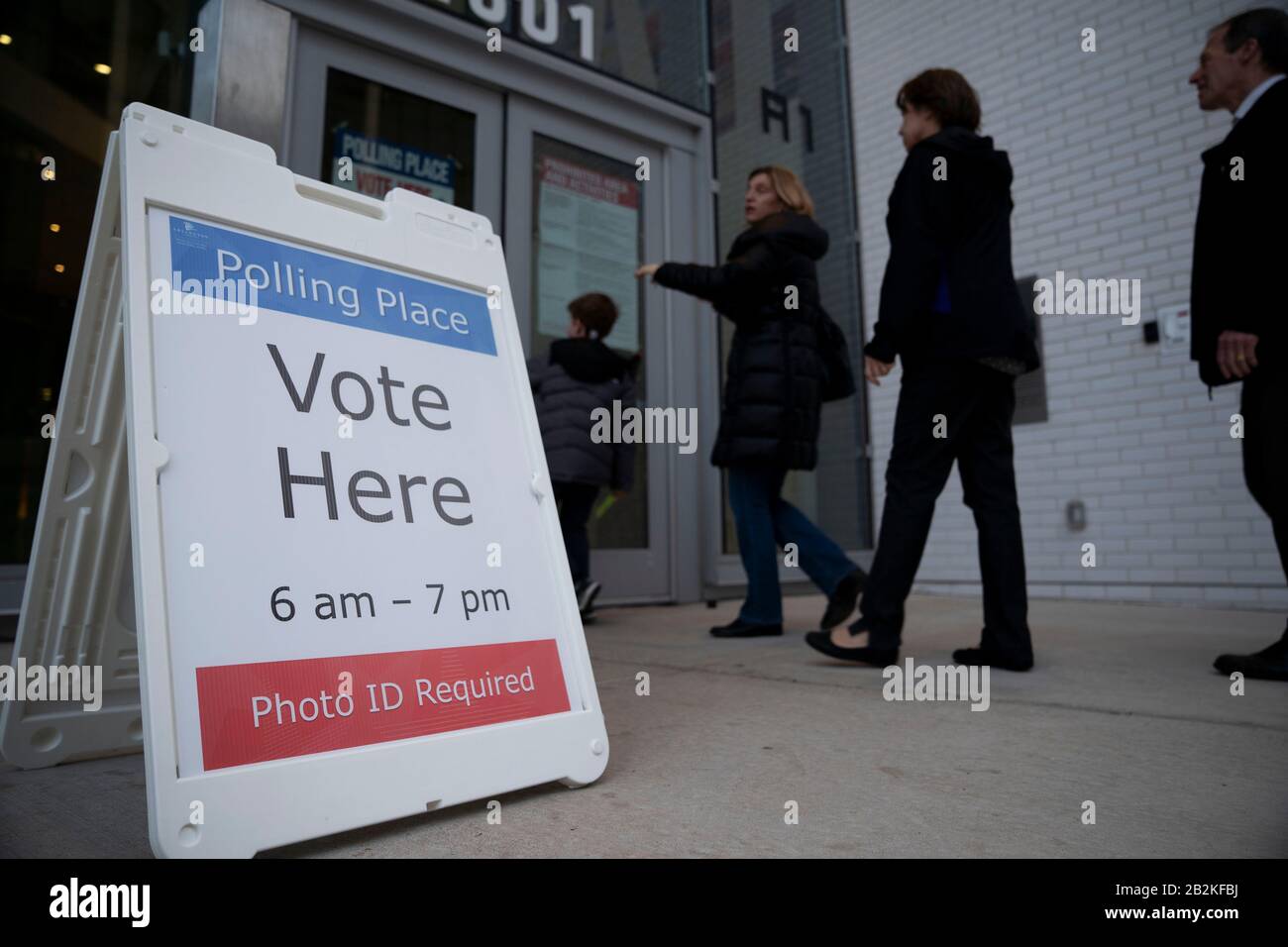 Arlington, USA. 3rd Mar, 2020. Voters walk into a polling station ...