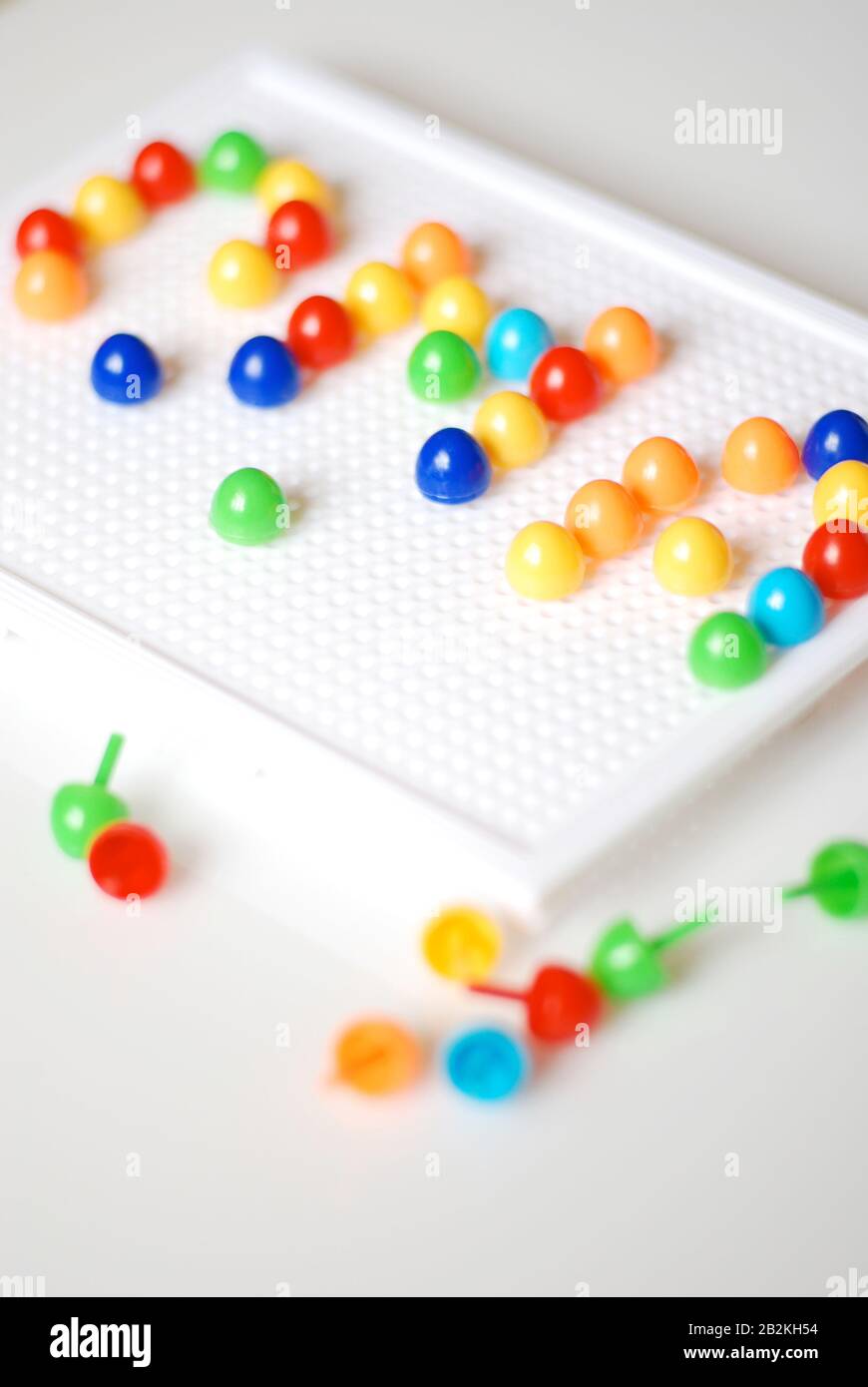 colorful stick button game vertical Stock Photo - Alamy