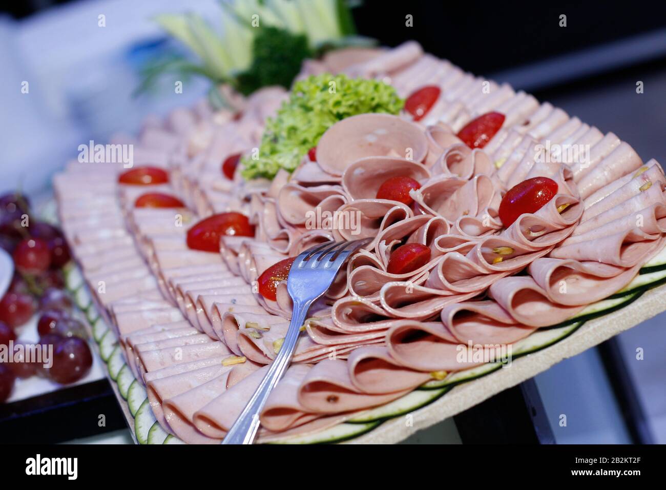 Trays full of slices of ham Stock Photo - Alamy