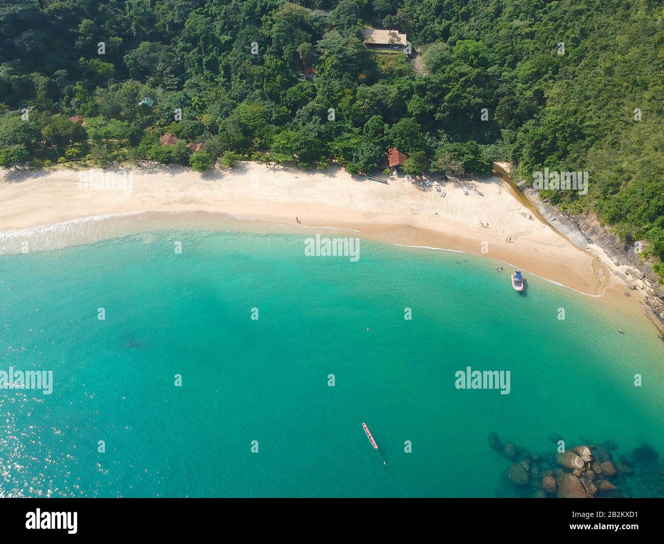 Aerial view of white sandy beach with turquoise water in tropical ...