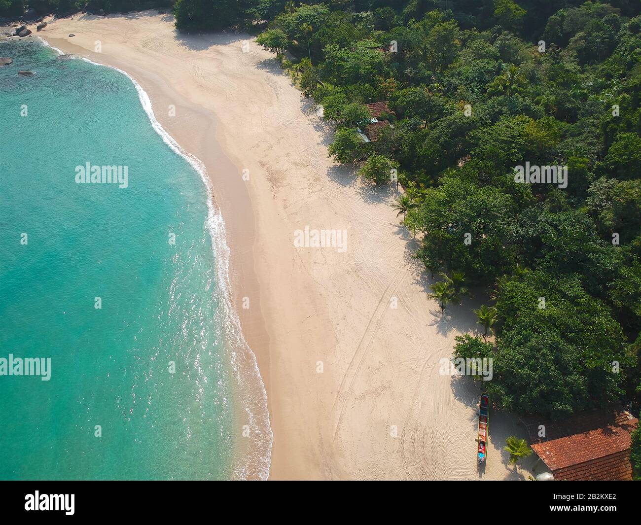 Aerial view of white sandy beach with turquoise water in tropical ...