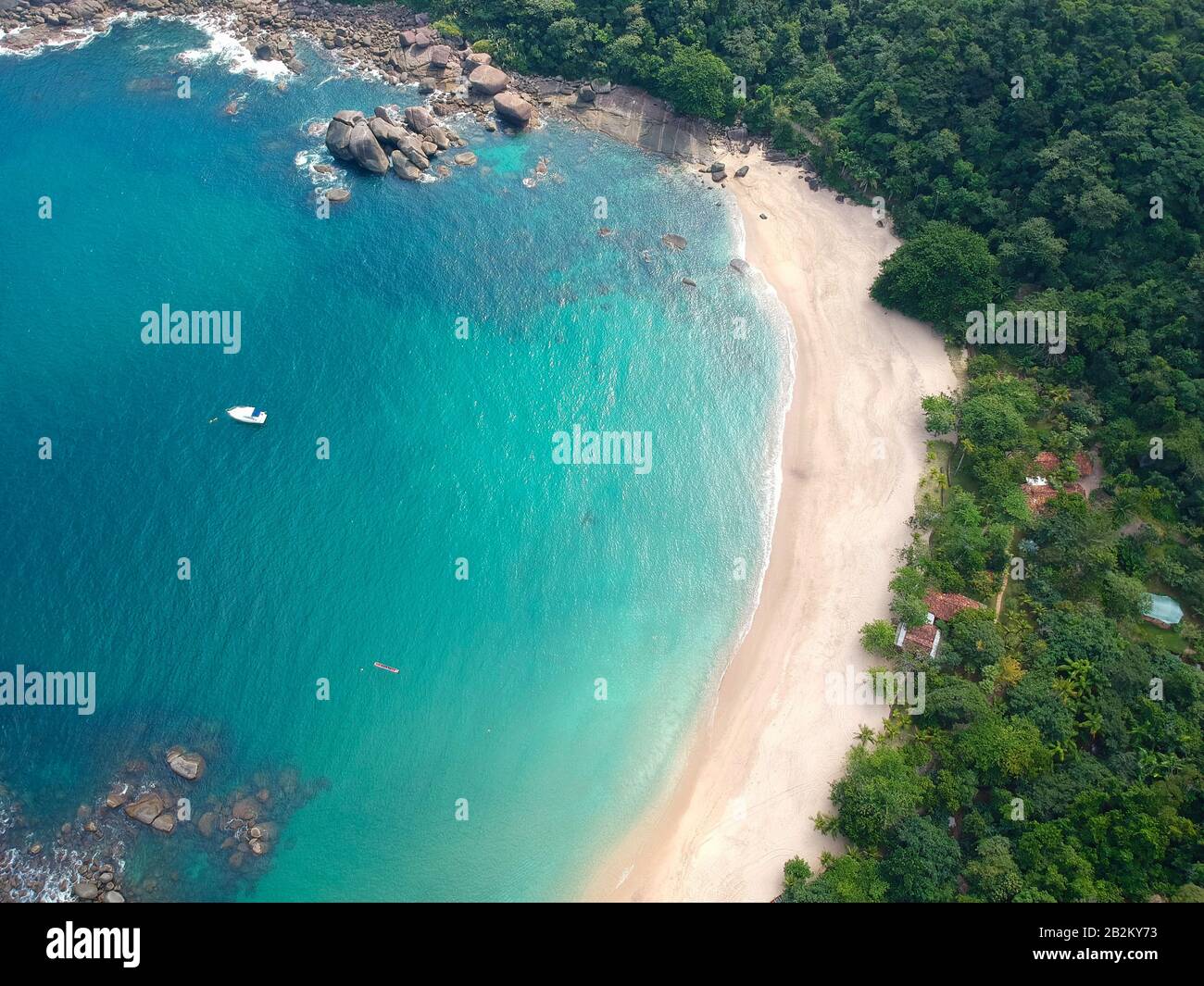 Aerial view of white sandy beach with turquoise water in tropical ...