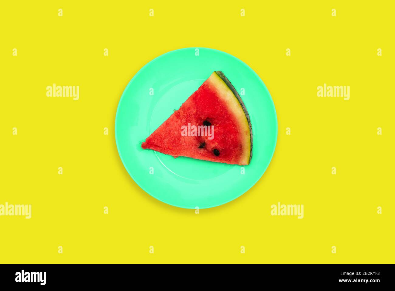 Watermelon slice on a colored background. Round plate of menthol on a ...