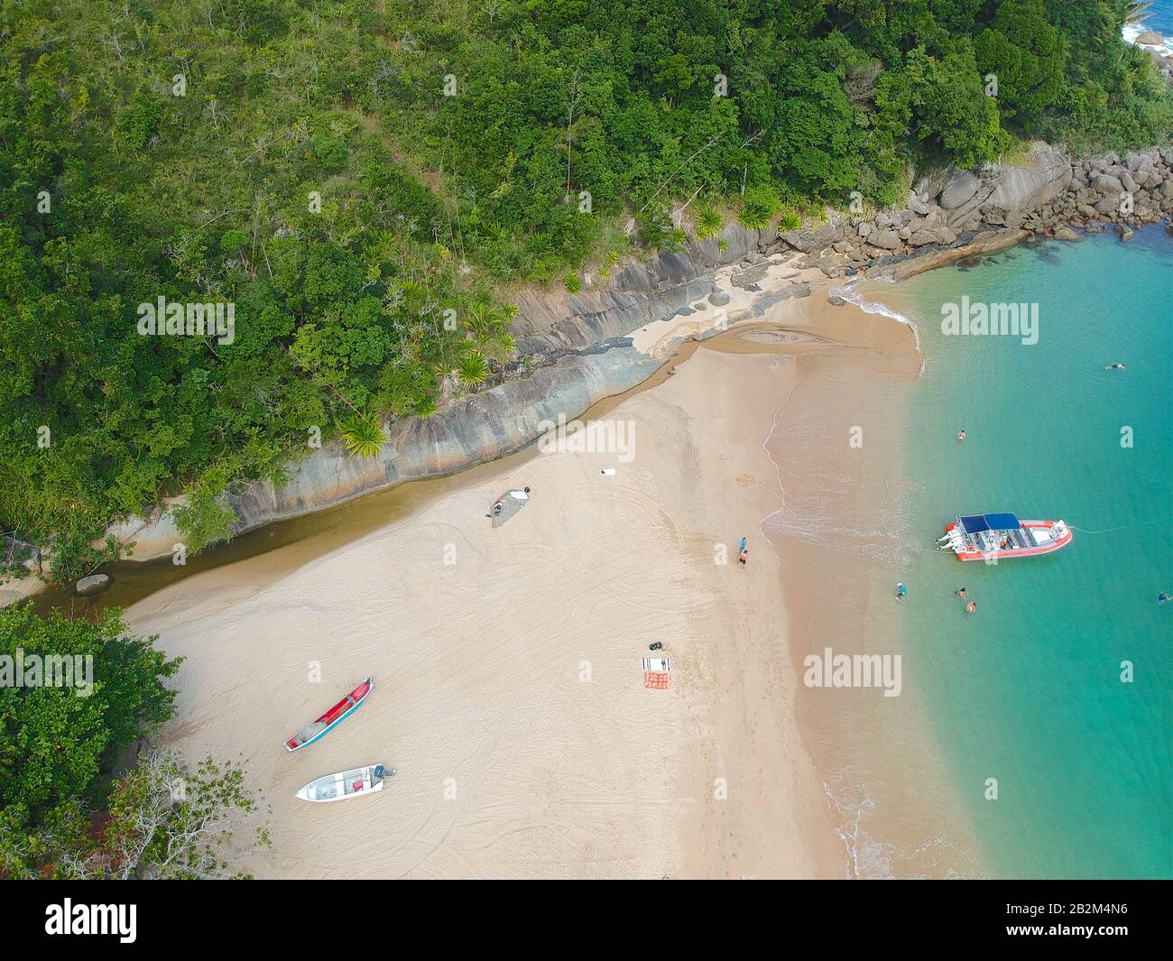 Aerial view of white sandy beach with turquoise water in tropical ...
