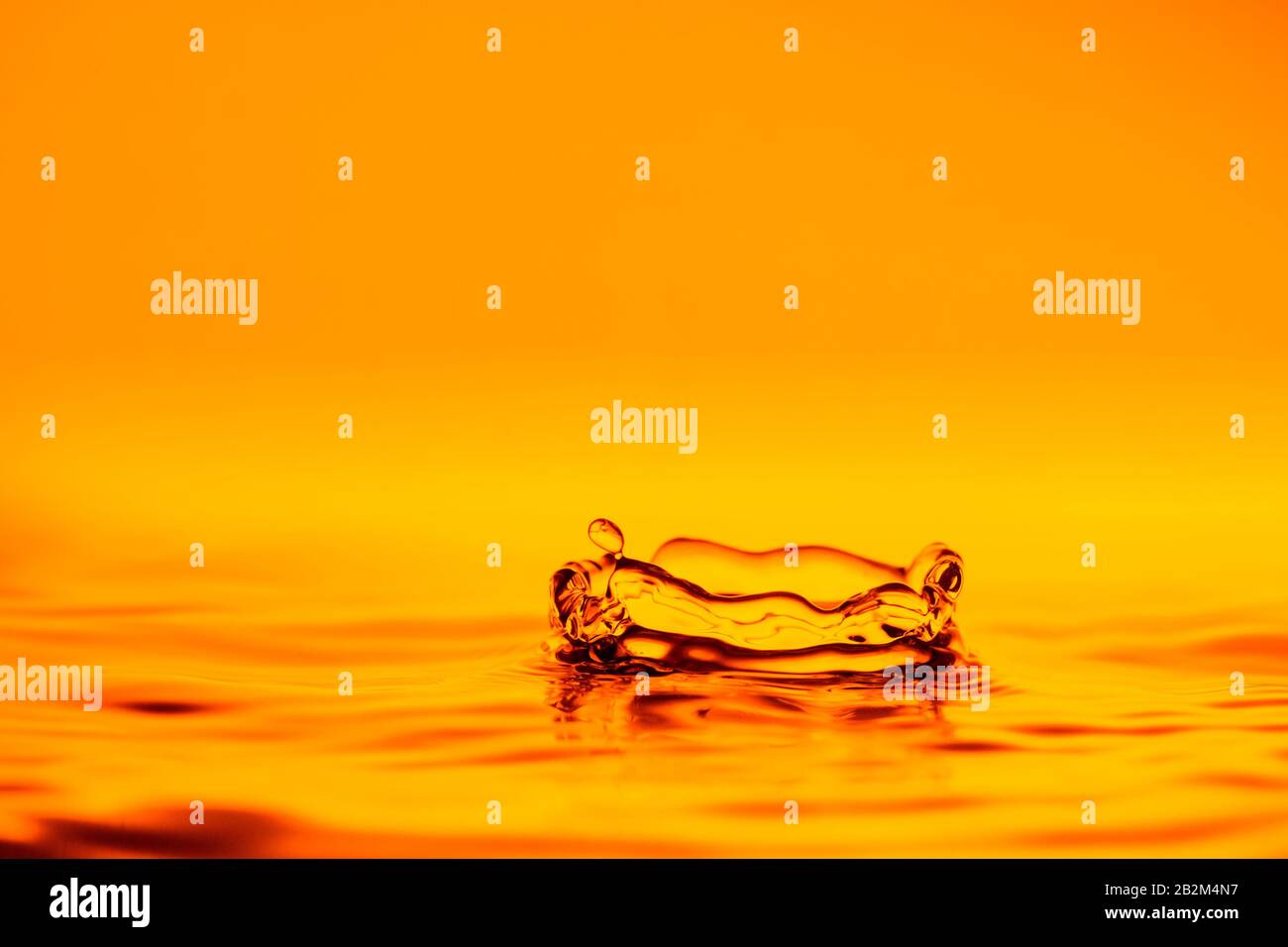 Gold Water Splash Losing Into The Background Stock Photo - Alamy