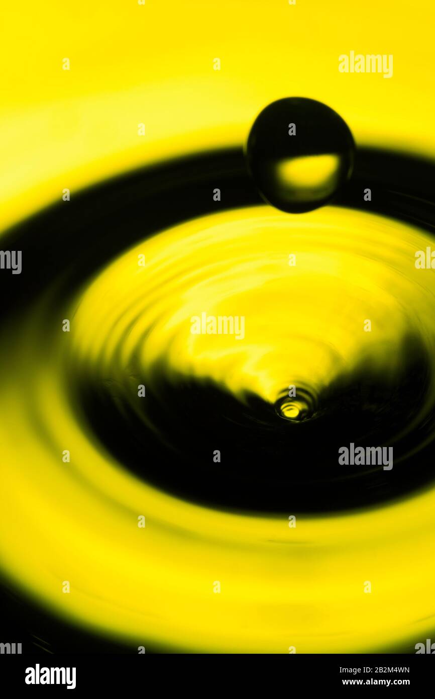 High Angle View Of A Water Drop Bouncing From The Surface Focus On The ...