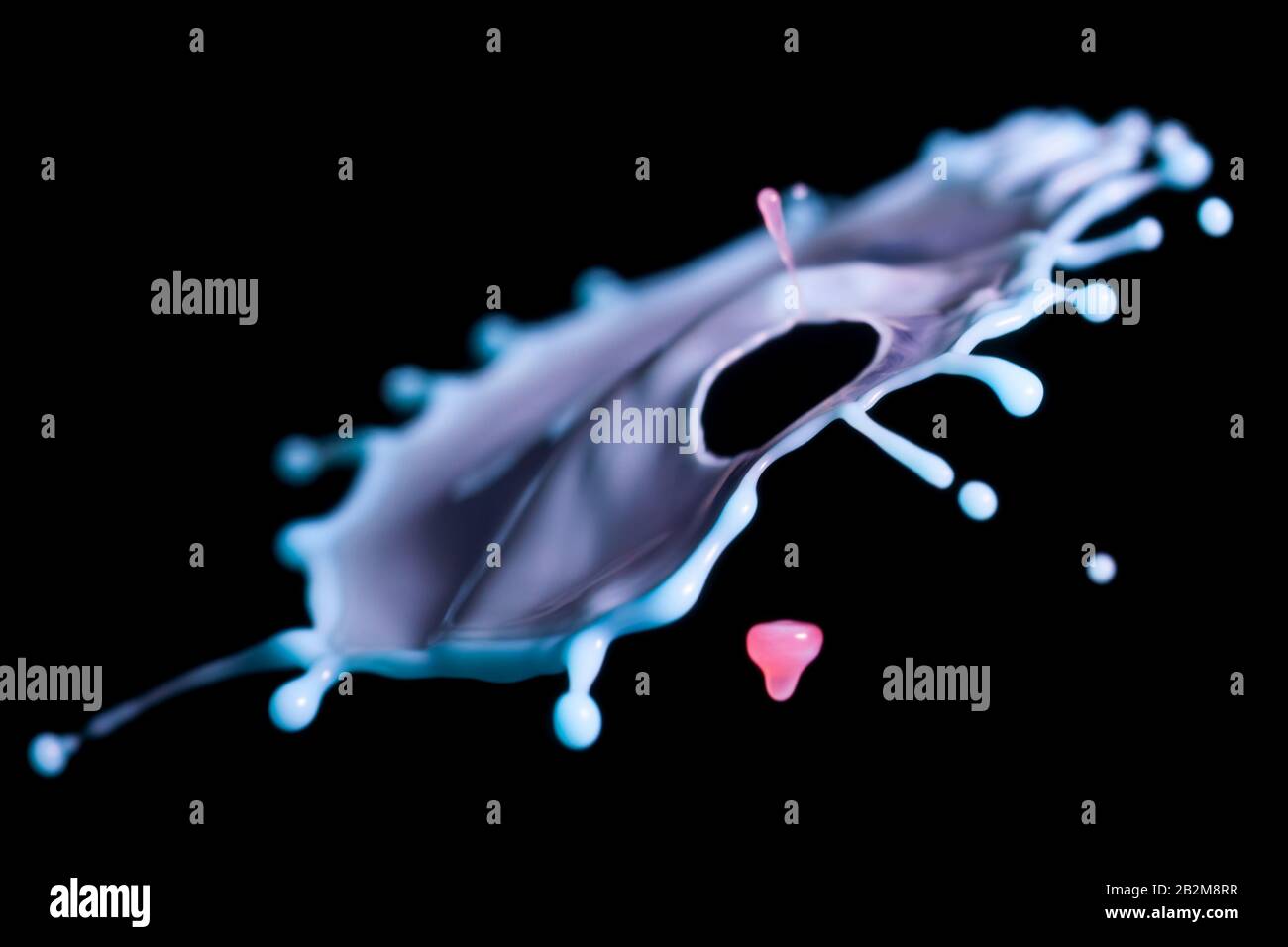 Liquid Splash Resulting From The Collision Of Two Droplets Stock Photo ...