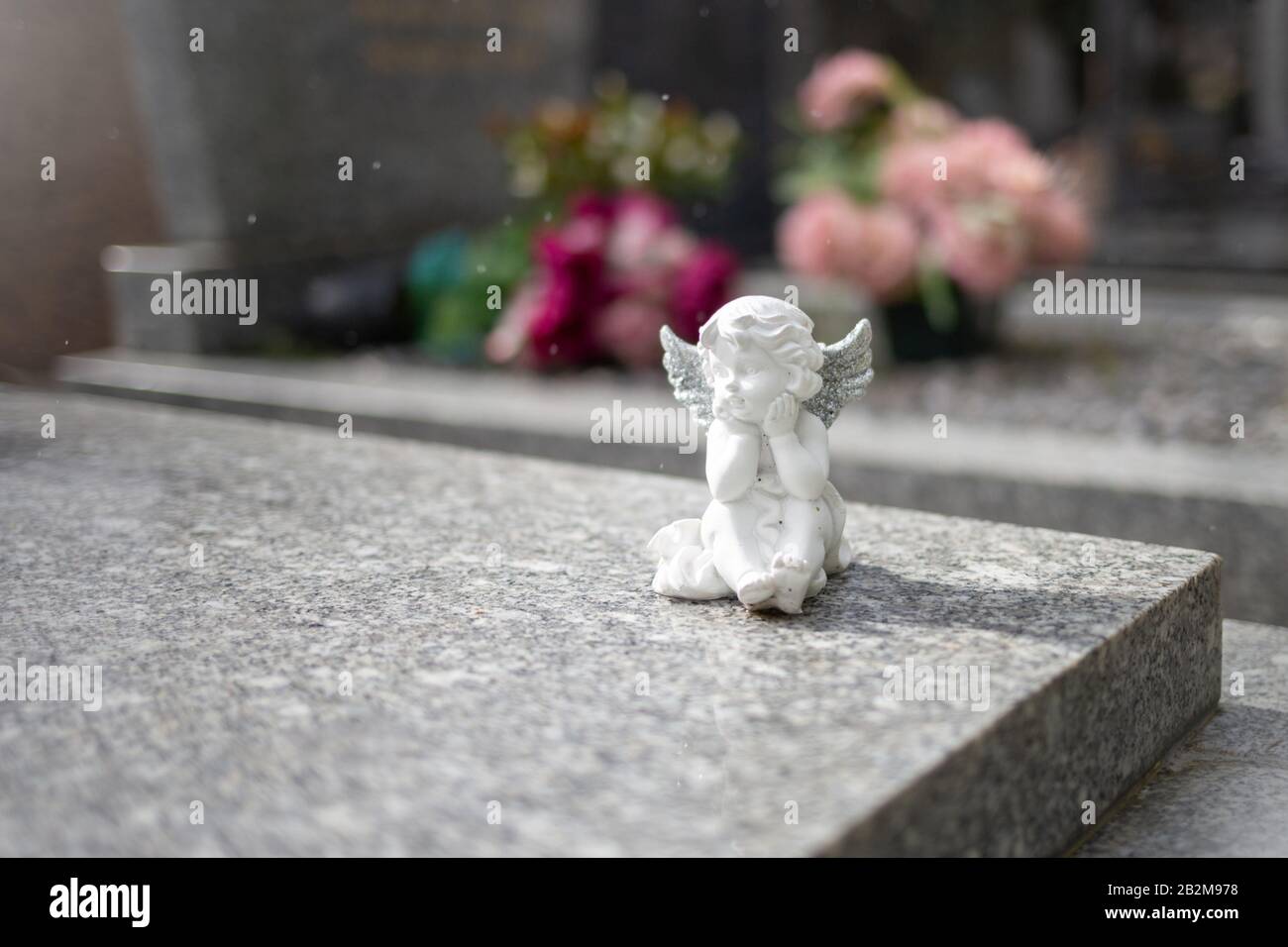 stoned angel at cemetery, graveyard on a bcakground, grave sculpture ...