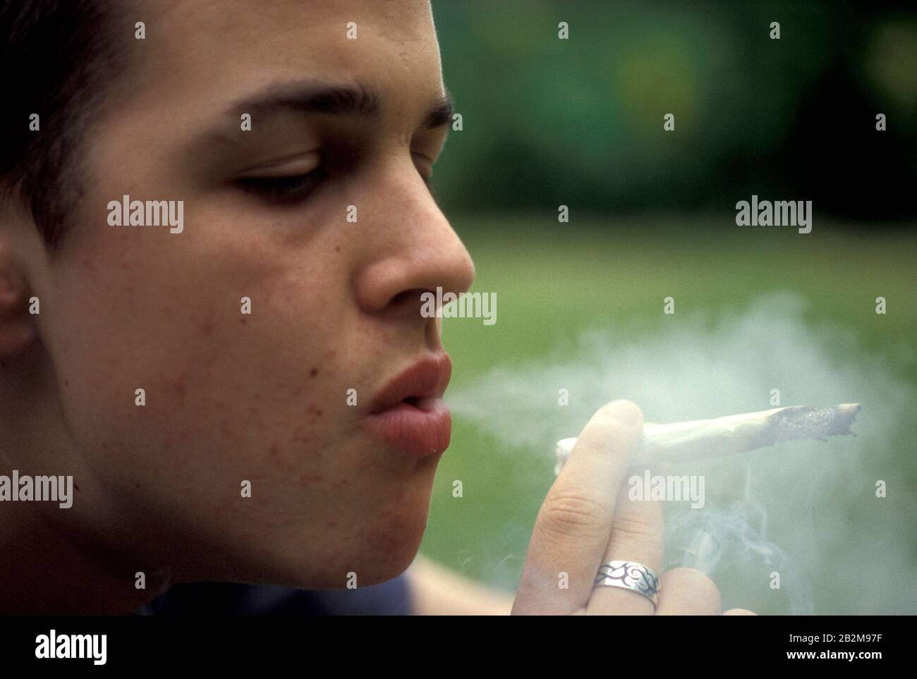 16 year old youth smoking a joint UK. Posed by model Stock Photo - Alamy