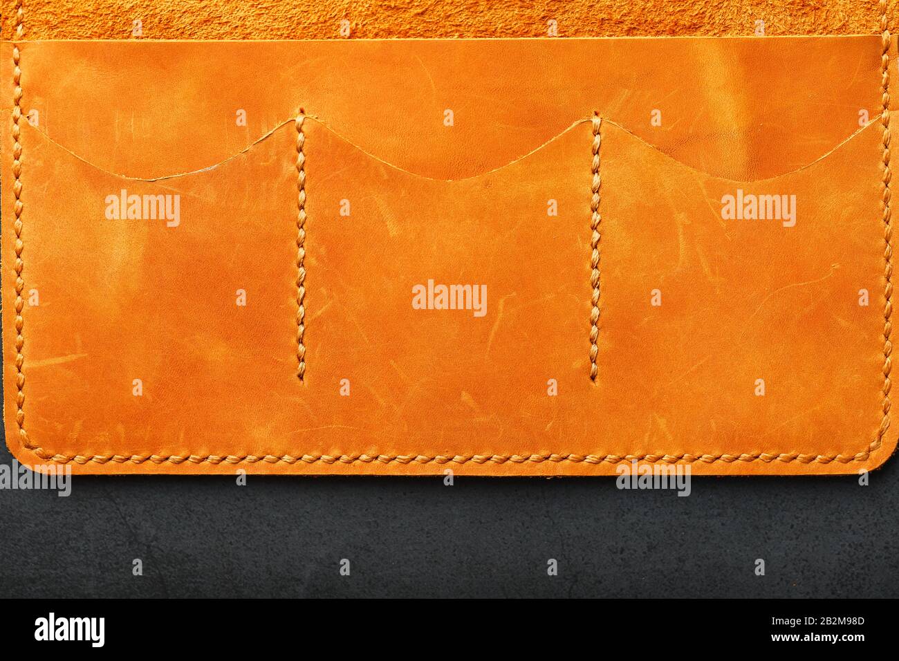 Brown purse, wallet made of genuine leather Nubuck on a dark background ...