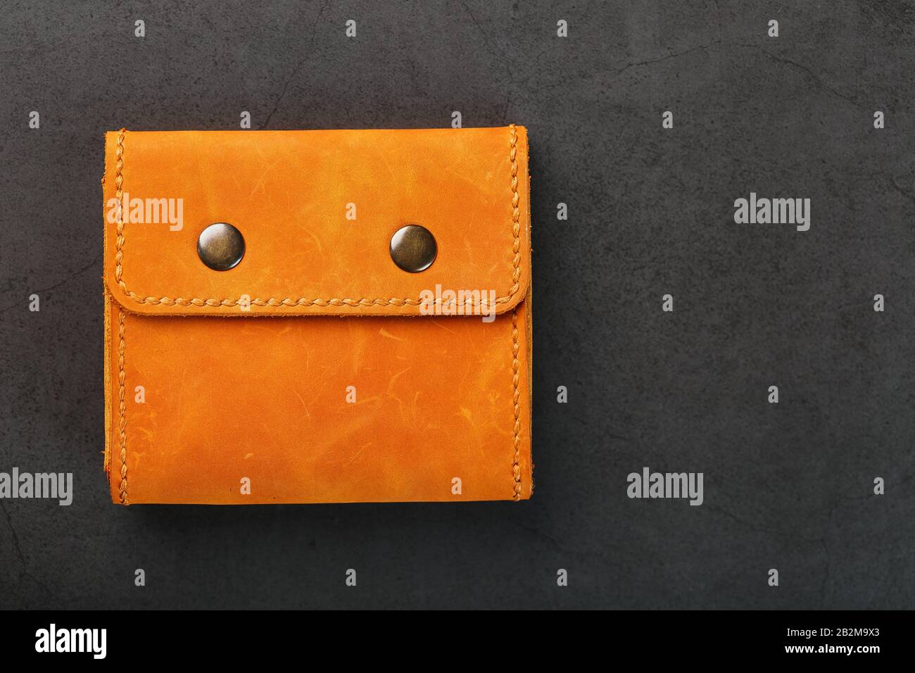 Brown purse, wallet made of genuine leather Nubuck on a dark background ...